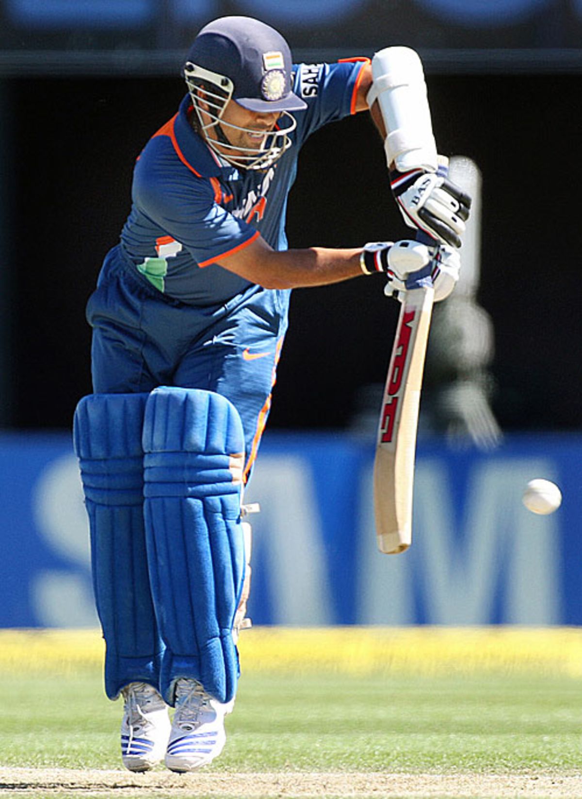 Sachin Tendulkar gets off the ground to work the ball away to the leg ...