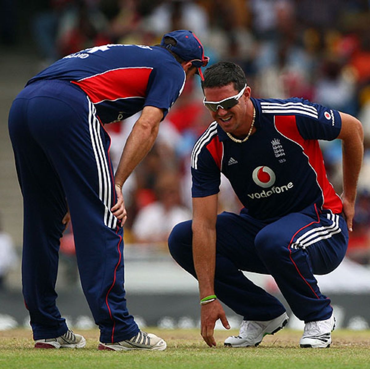 Kevin Pietersen pulls up with a back twinge as Andrew Strauss looks on ...