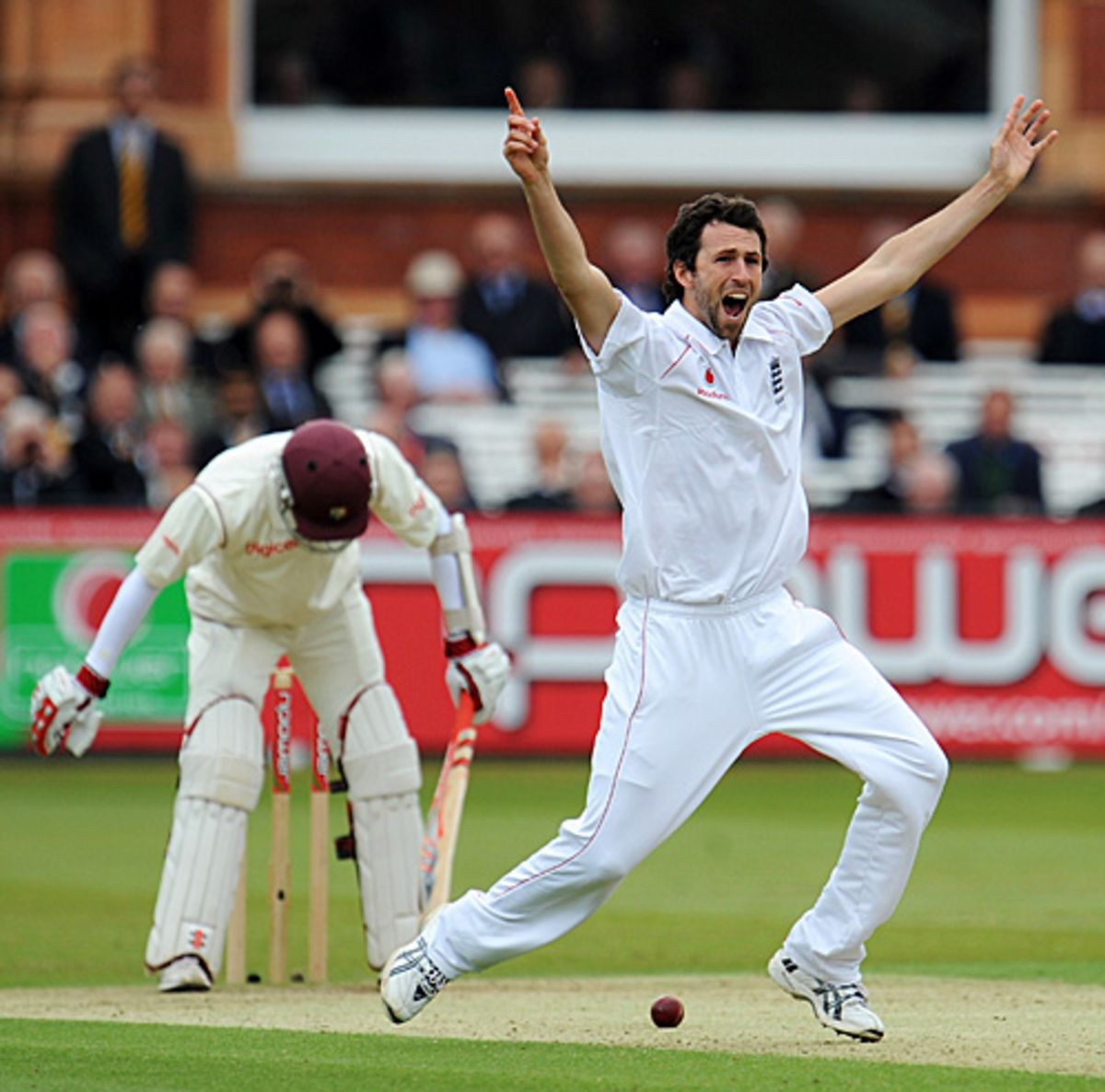 Graham Onions celebrates on his back after taking his fourth wicket on ...