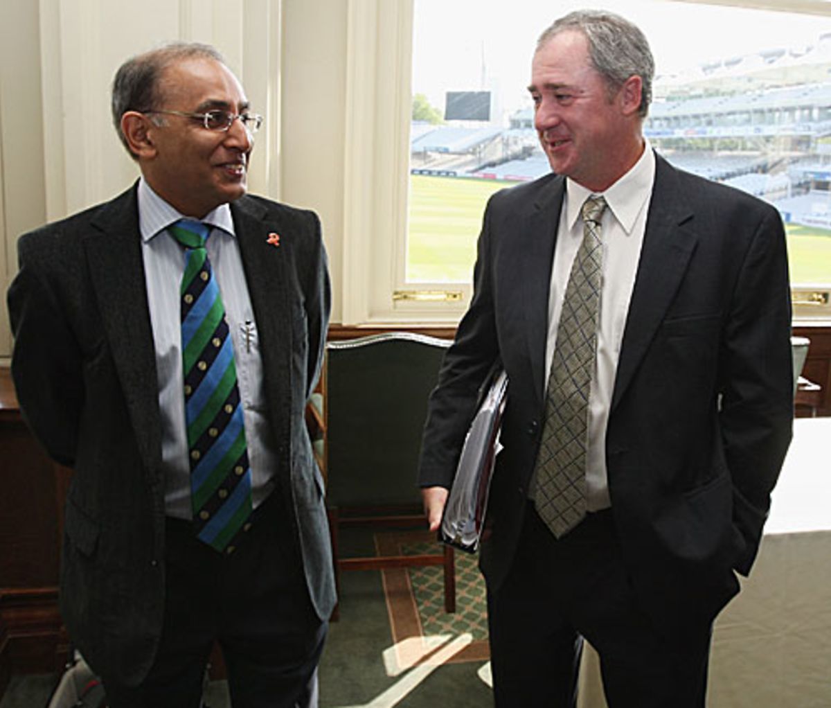 Haroon Lorgat chats with Tim May at the ICC Committee meeting ...