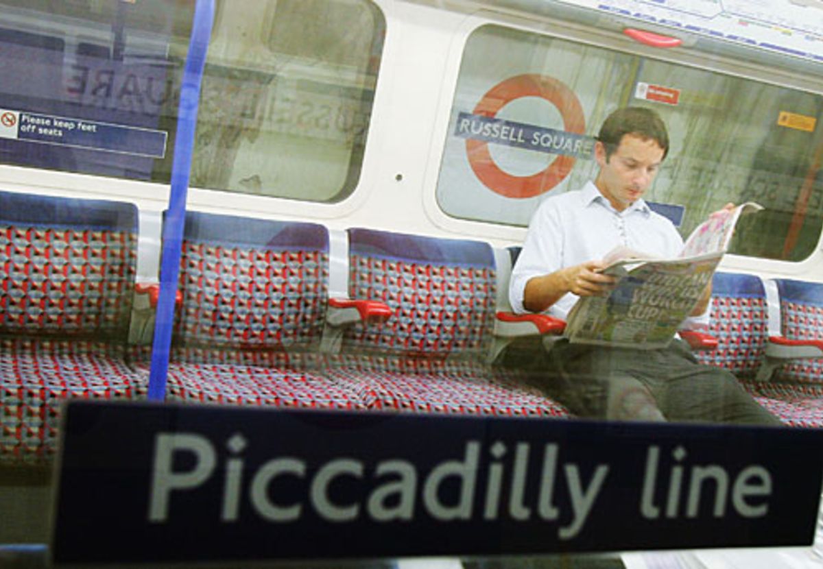 A passenger travels on the London tube's Piccadilly line from King's ...