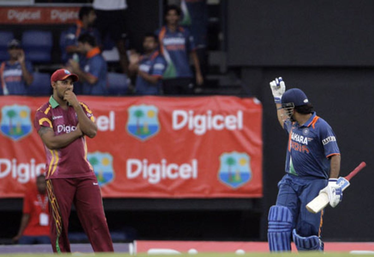 MS Dhoni flashes a thumbs-up sign after guiding India to a 2-1 series ...