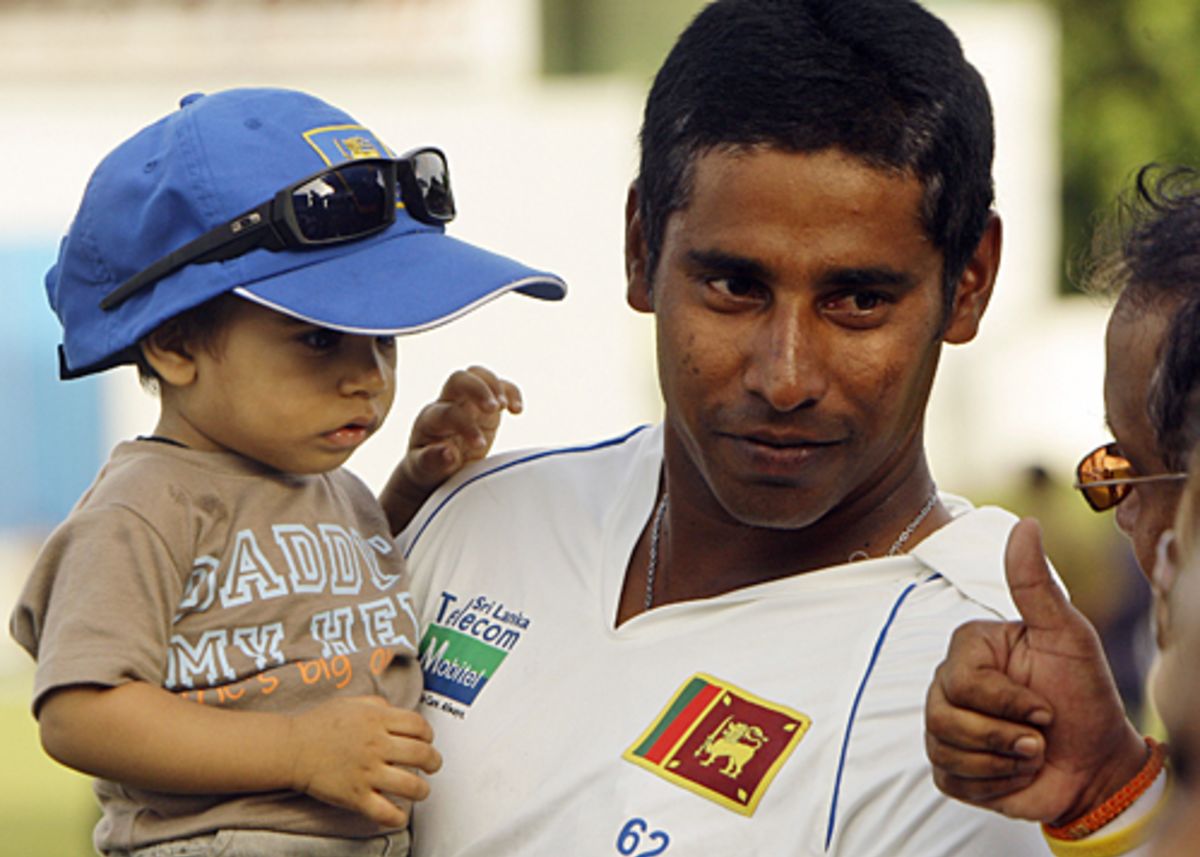 Chaminda Vaas with his son at the post-match presentation ...
