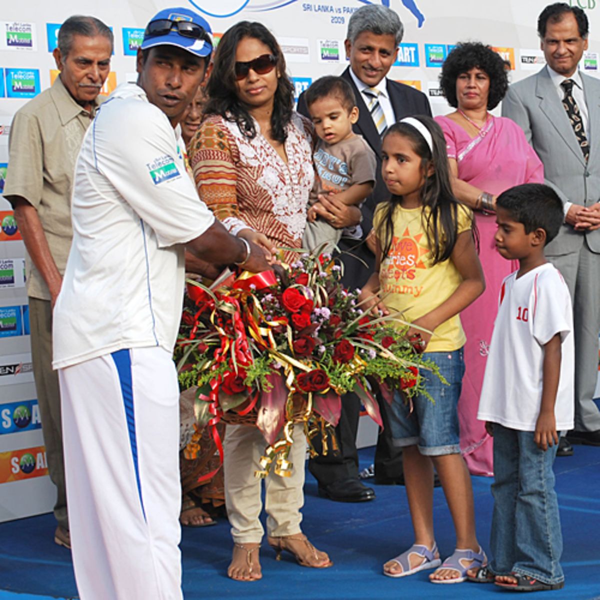 Chaminda Vaas with his son at the post-match presentation ...