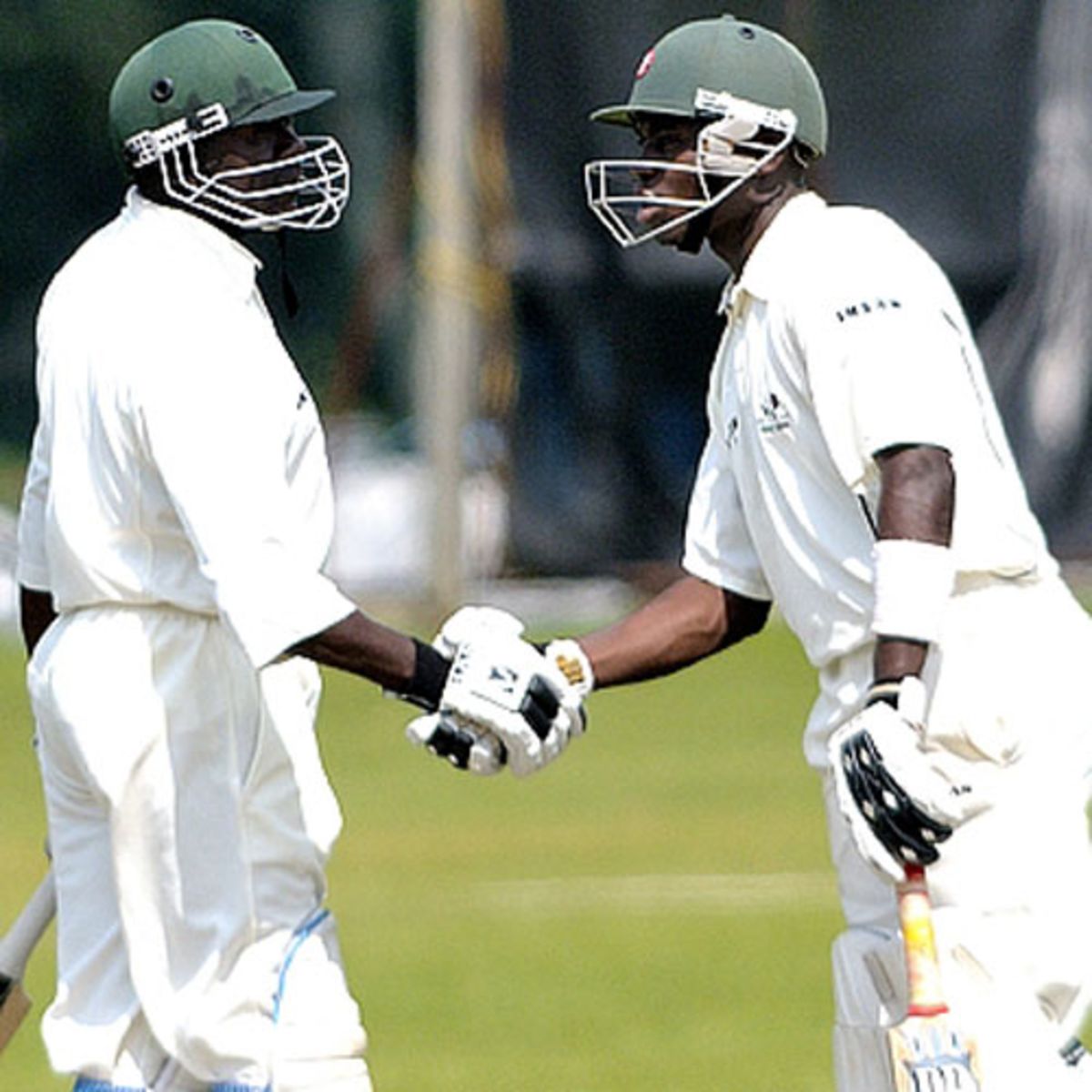 Steve Tikolo is congratulated on reaching his hundred | ESPNcricinfo.com