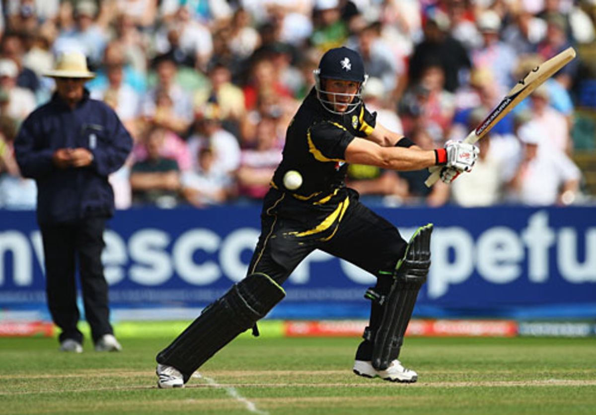 Liam Plunkett steams in at Michael Hussey, as Marcus North looks on ...
