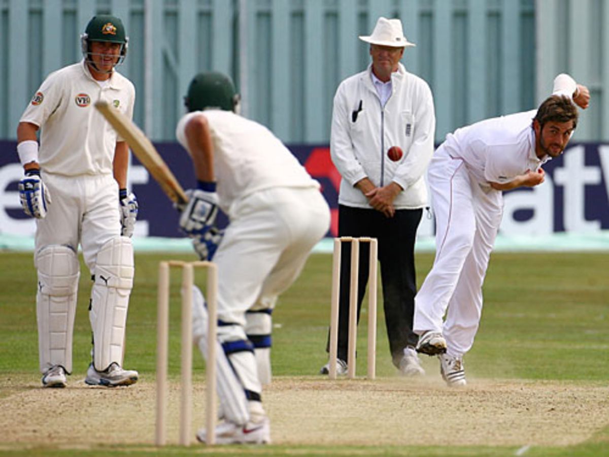 Liam Plunkett steams in at Michael Hussey, as Marcus North looks on ...