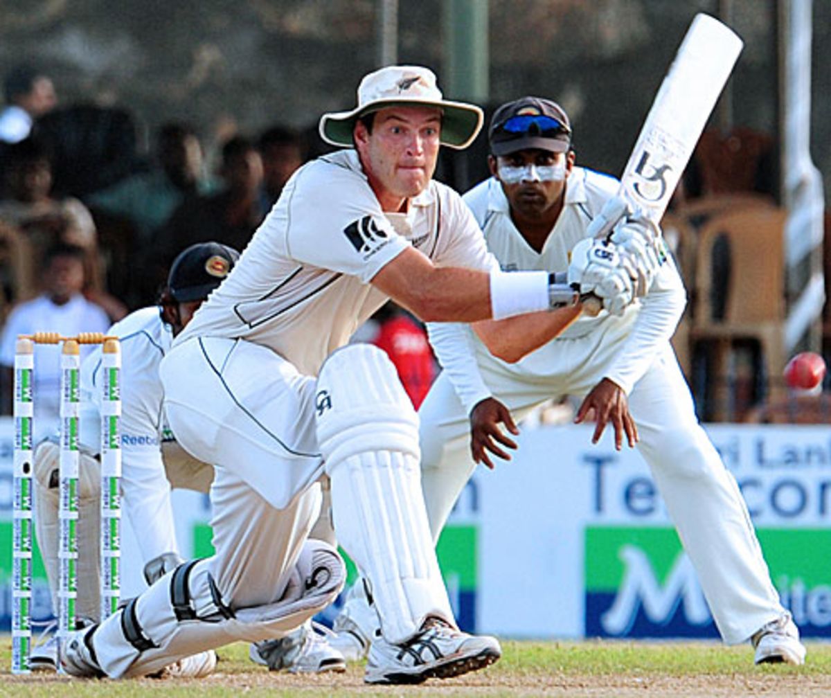 Tim McIntosh gets in position to sweep | ESPNcricinfo.com