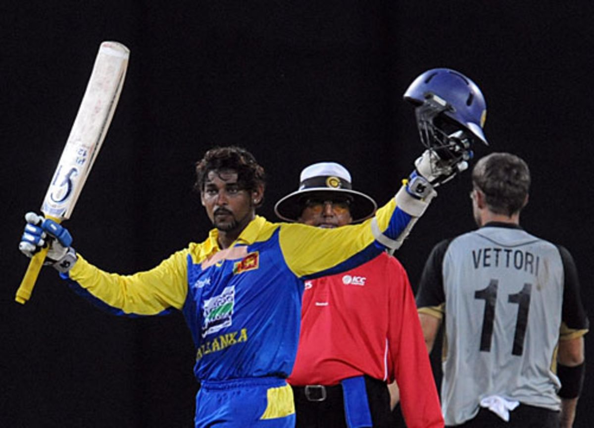 Tillakaratne Dilshan raises the bat after reaching his fifty off 23 ...