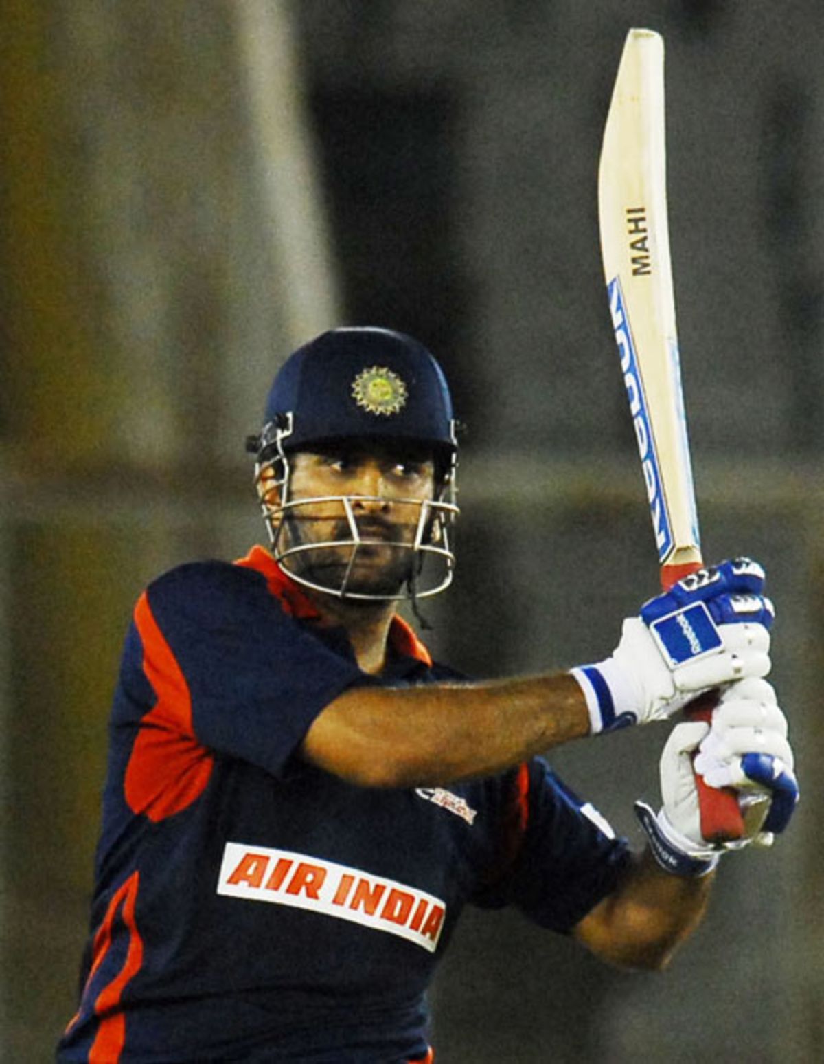 MS Dhoni swivels as he dispatches the ball to the leg side ...