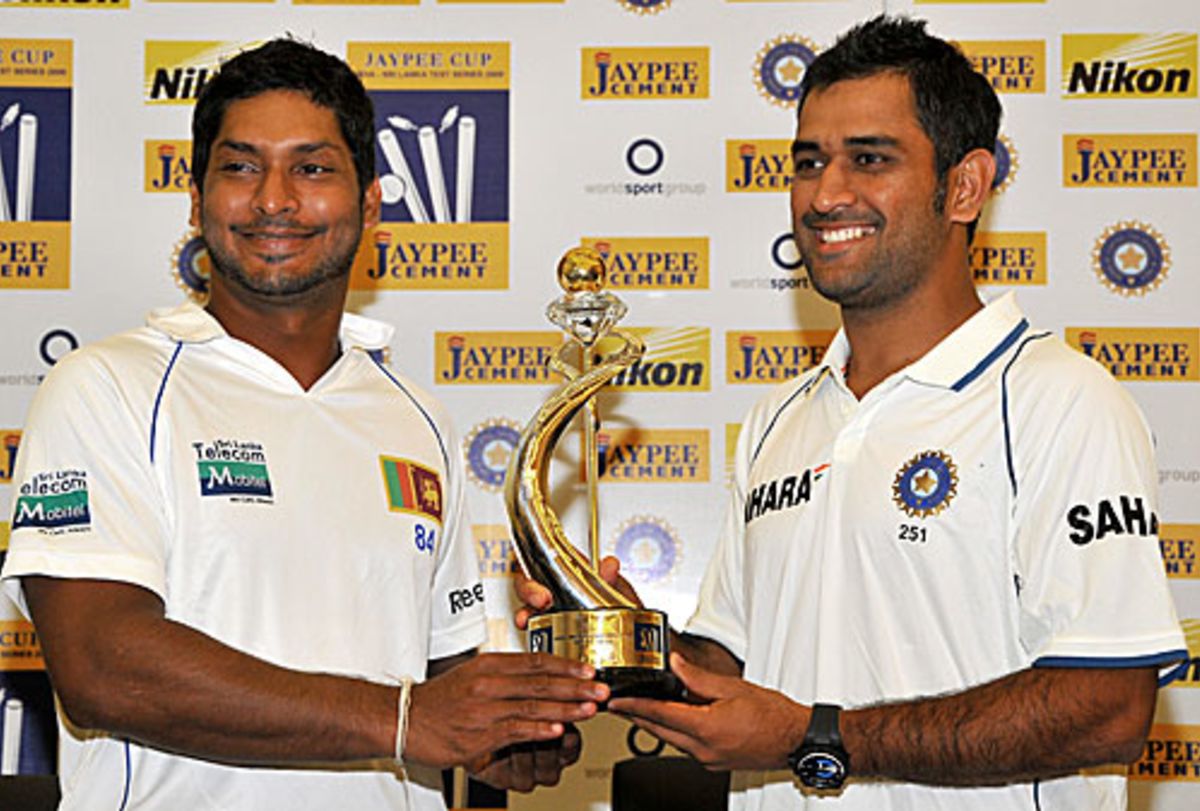 Kumar Sangakkara and MS Dhoni pose with the series trophy ...