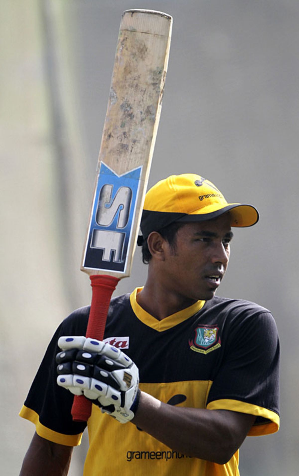 Raqibul Hasan admires a shot at the nets | ESPNcricinfo.com