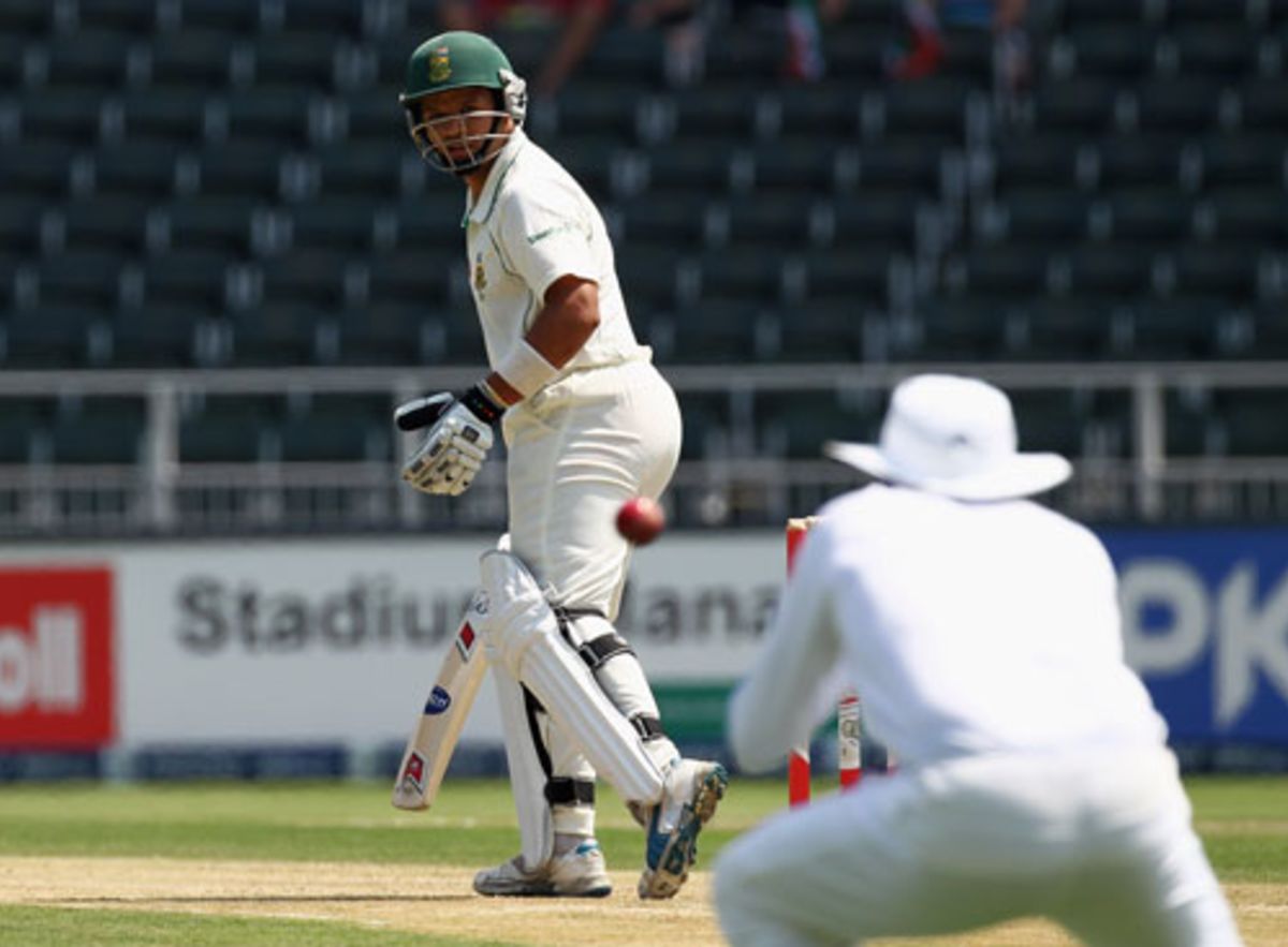 Ashwell Prince looks back as the ball flies off the edge to Graeme ...