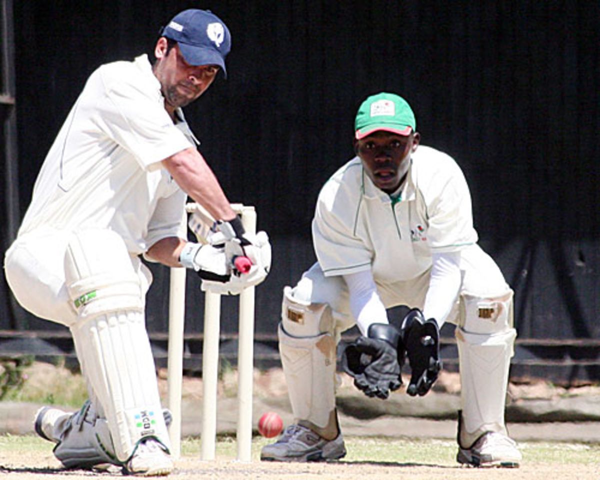 Qasim Sheikh celebrates his century | ESPNcricinfo.com