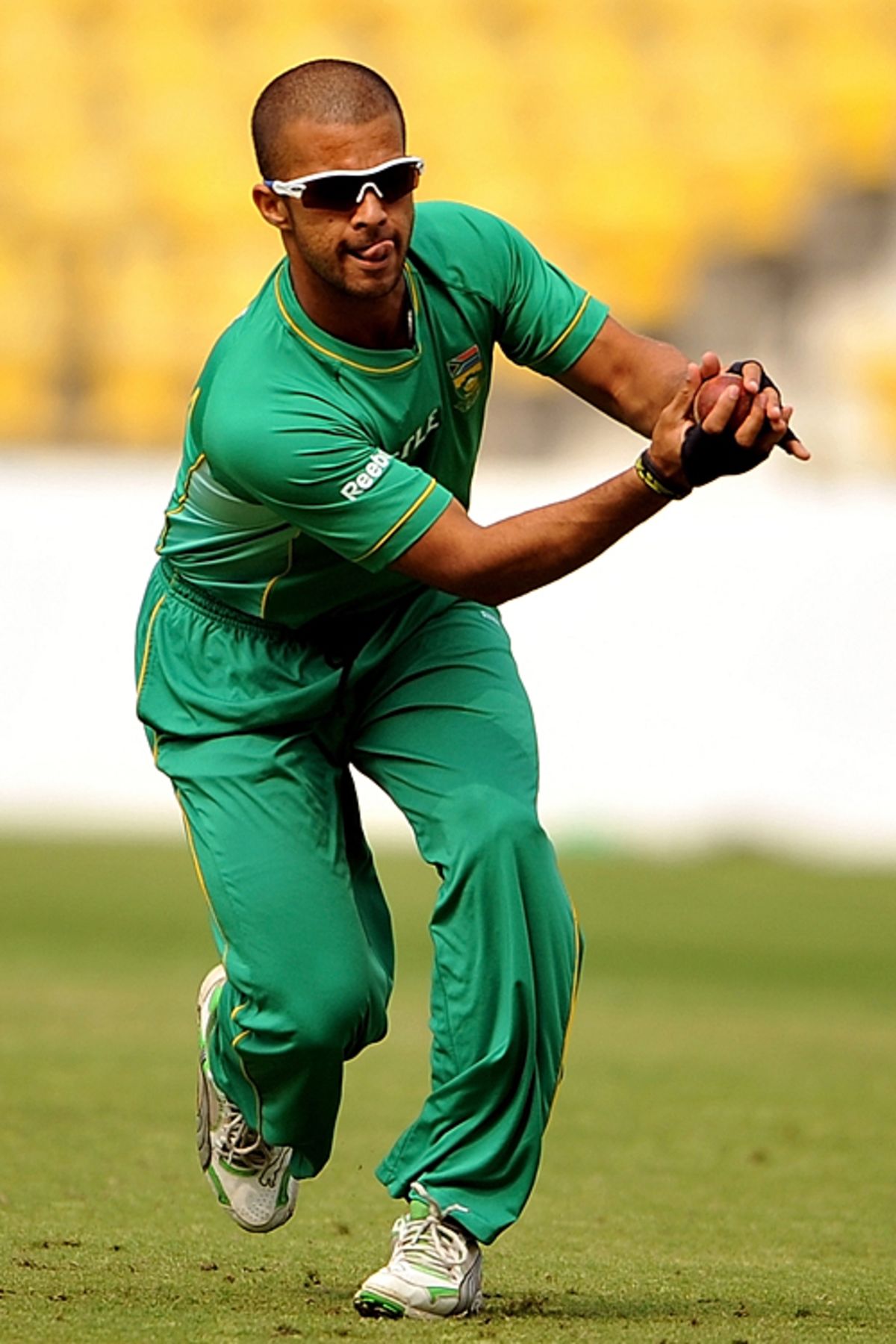 Abdool Samad plays through the off side as Mohammad Shahzad looks on ...
