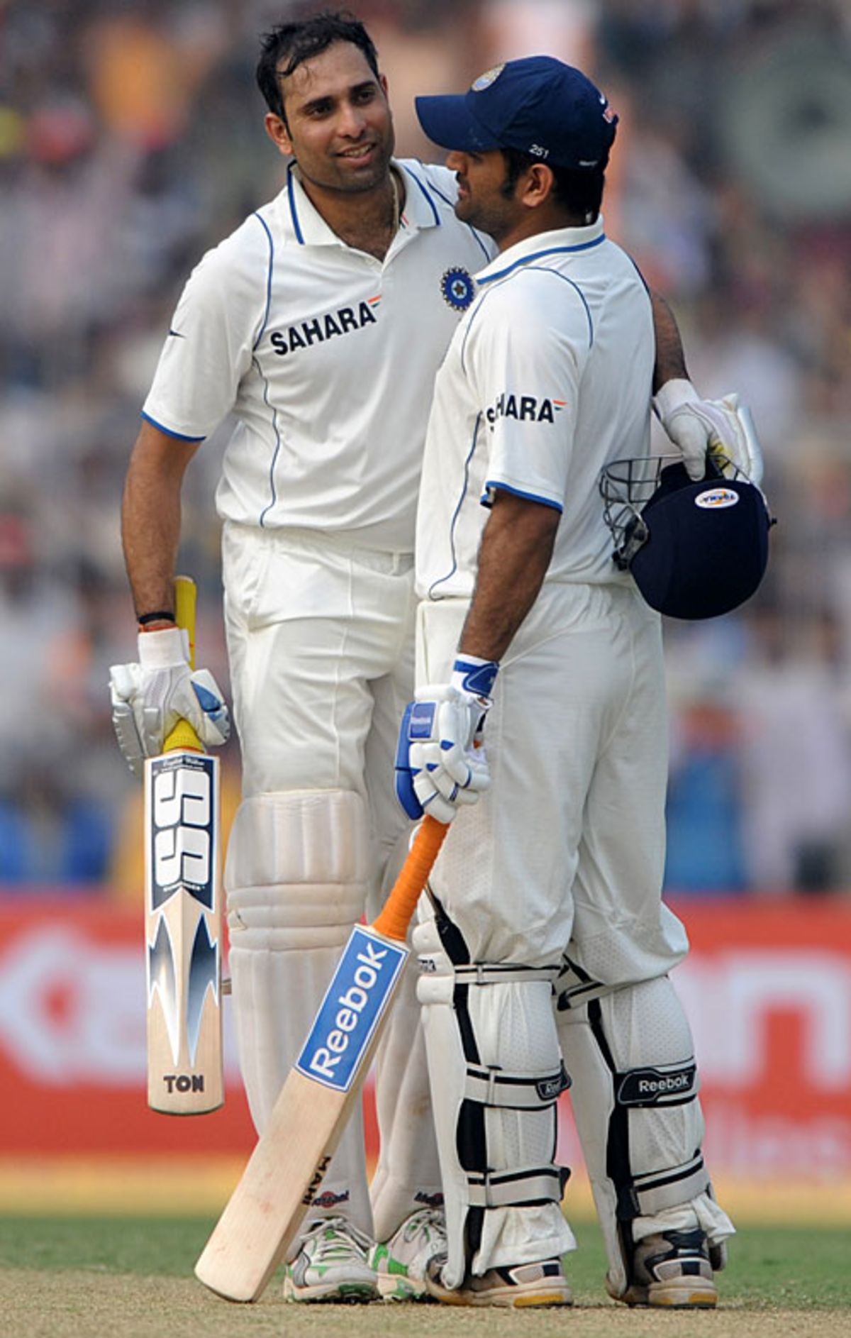 VVS Laxman is congratulated by MS Dhoni on getting to a hundred ...