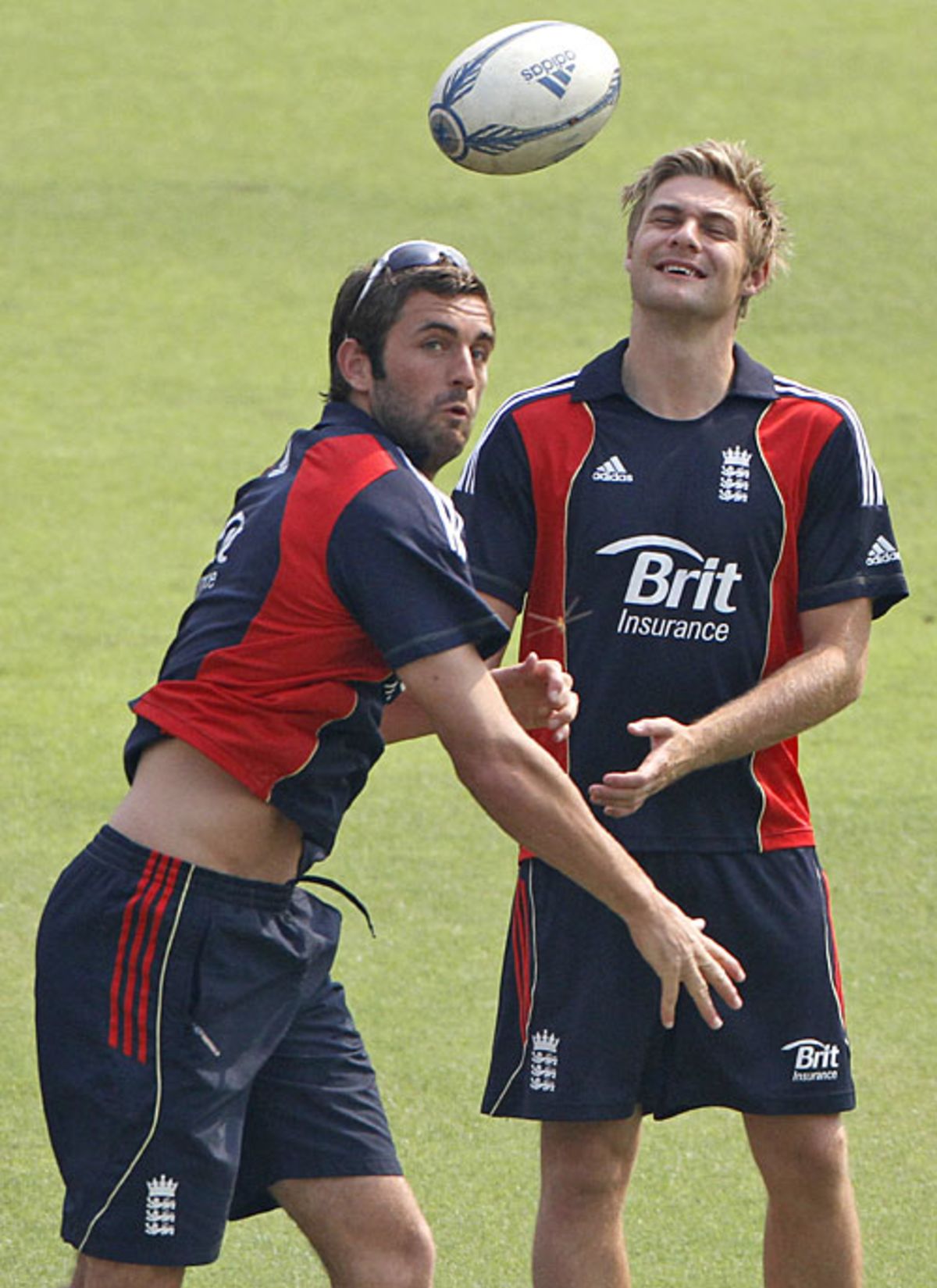 Liam Plunkett and Luke Wright enjoy a game of rugby during practice ...