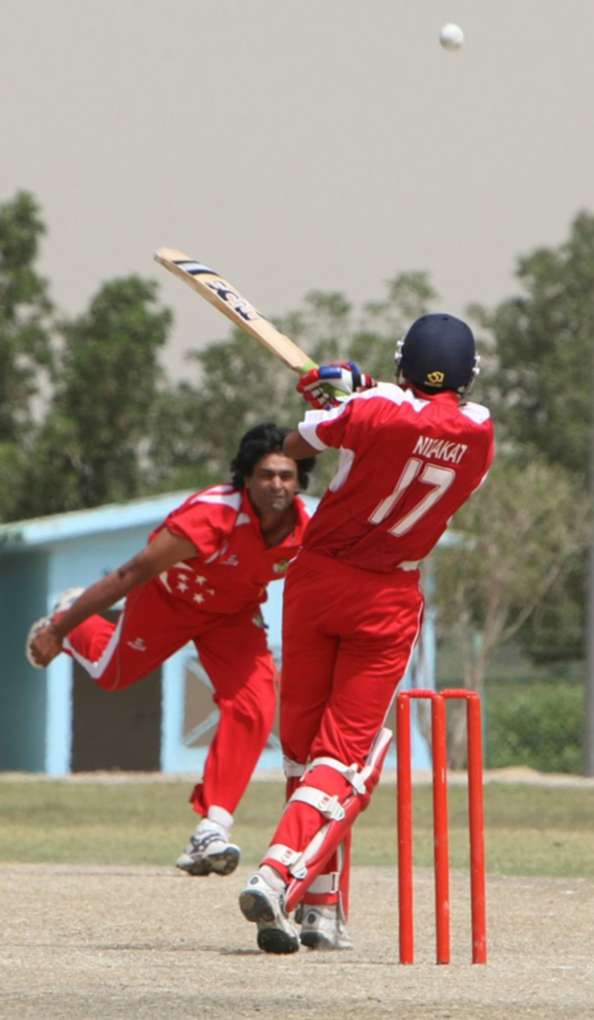 Nizakat Khan smashes a back foot straight six off the bowling of ...