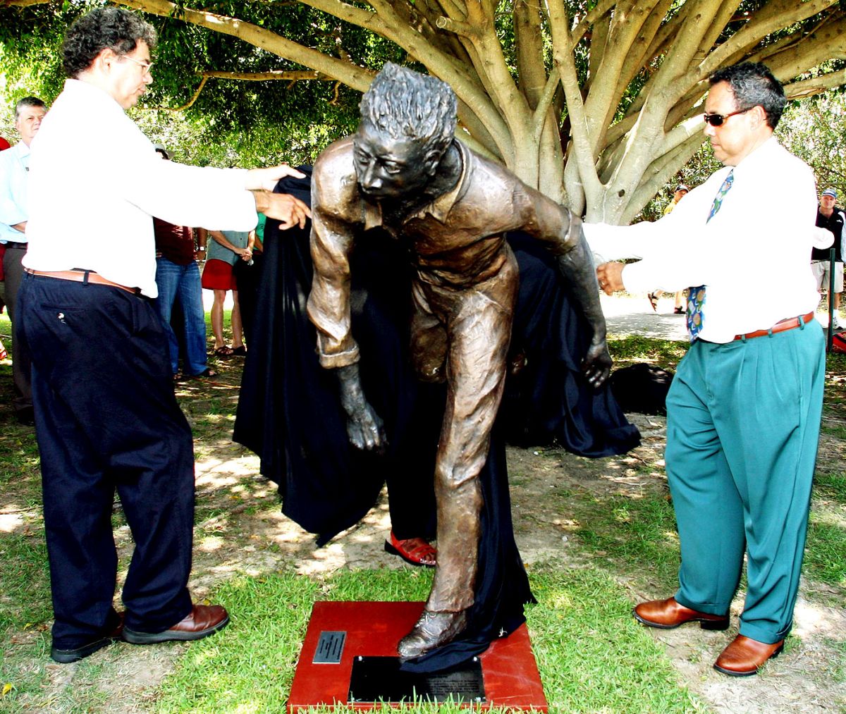 Wayne Coolwell and Larry Budd unveil a statue of Eddie Gilbert ...