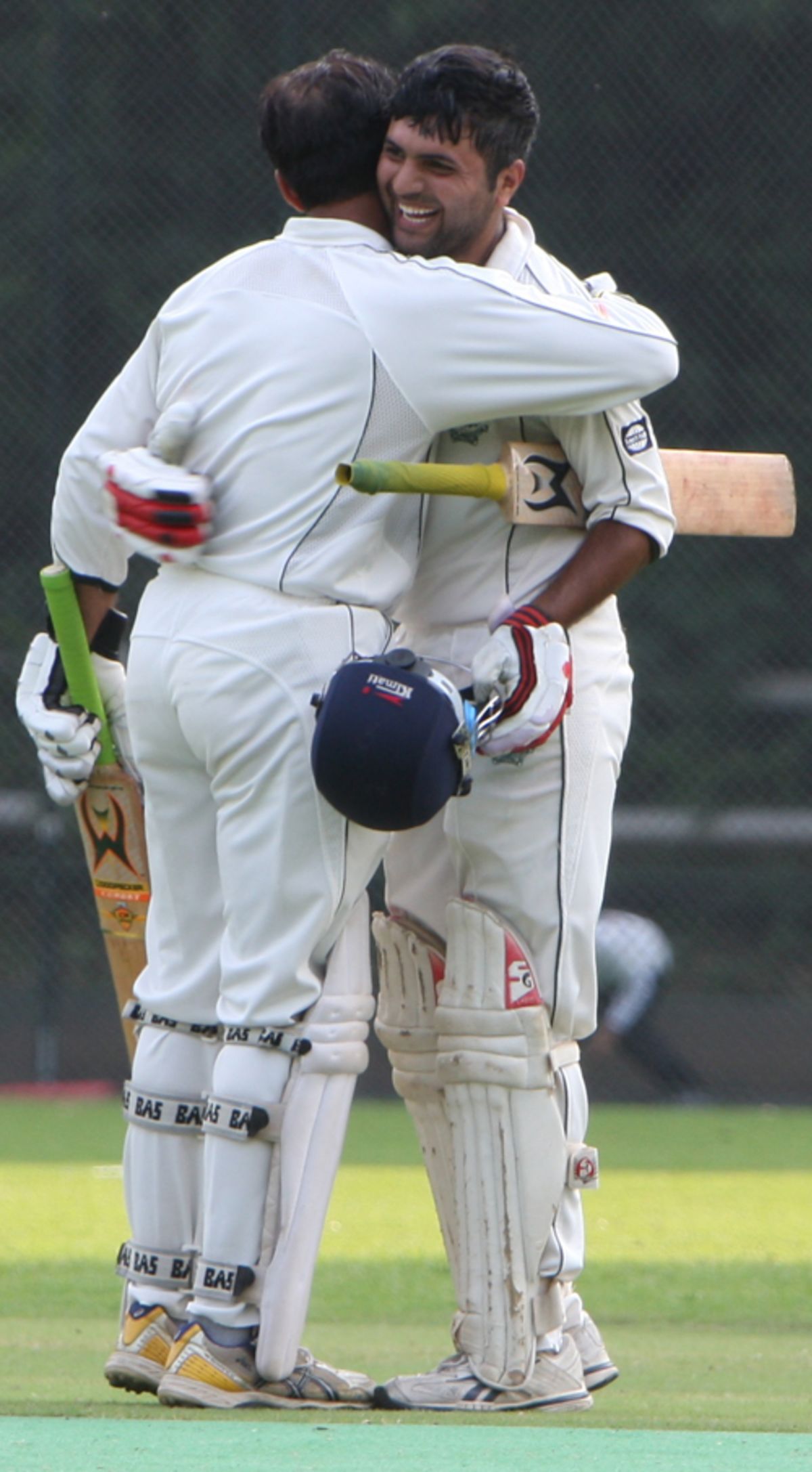 Ankur Sharma and Najeeb Amar embrace | ESPNcricinfo.com