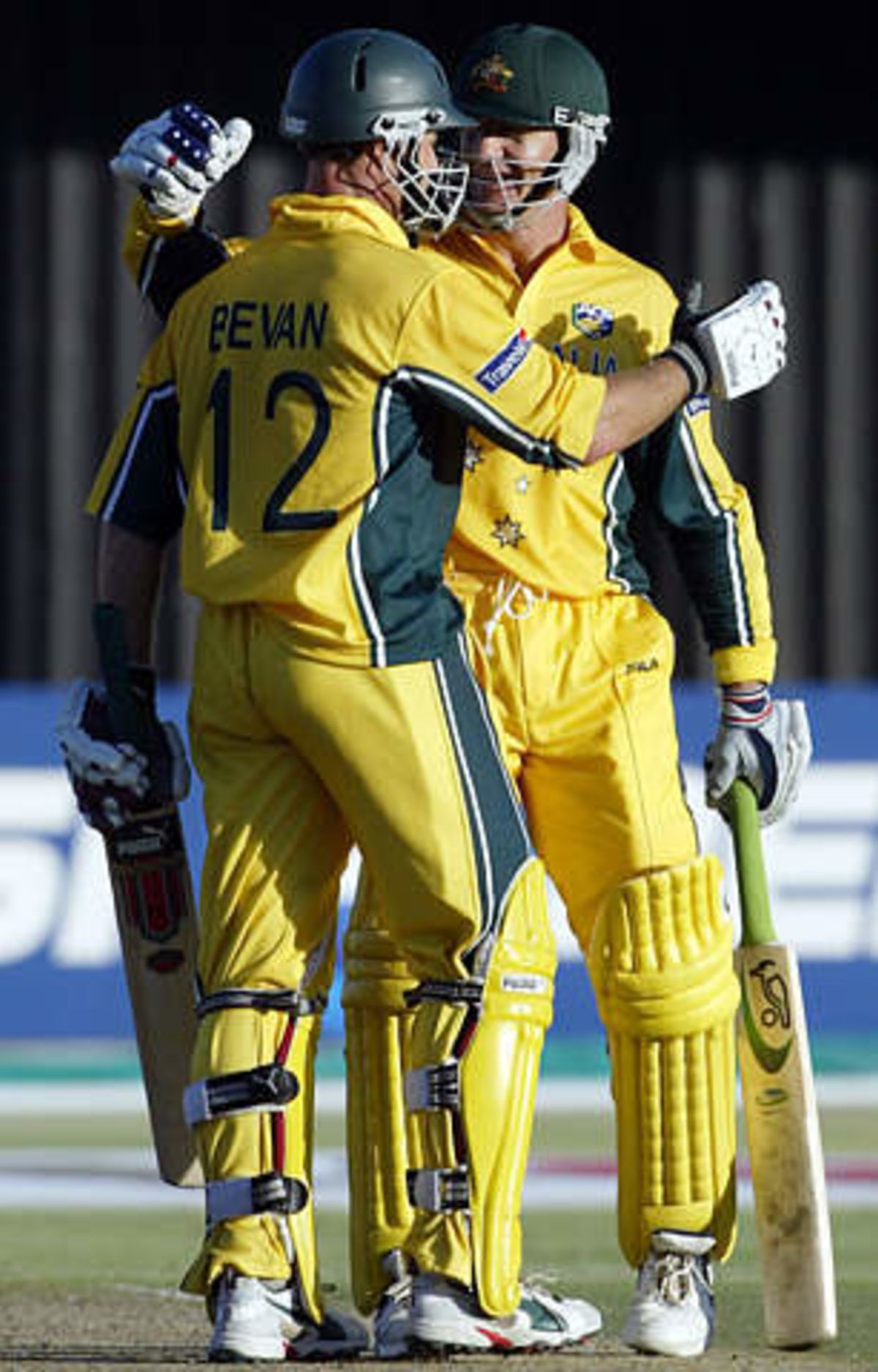 Andy Bichel runs holding a stump after Australia's victory ...