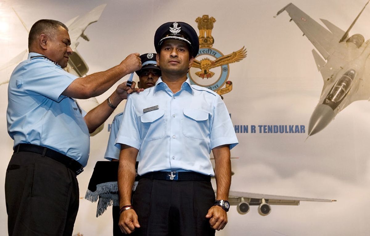 Group Captain Sachin Tendulkar salutes after receiving his honorary ...