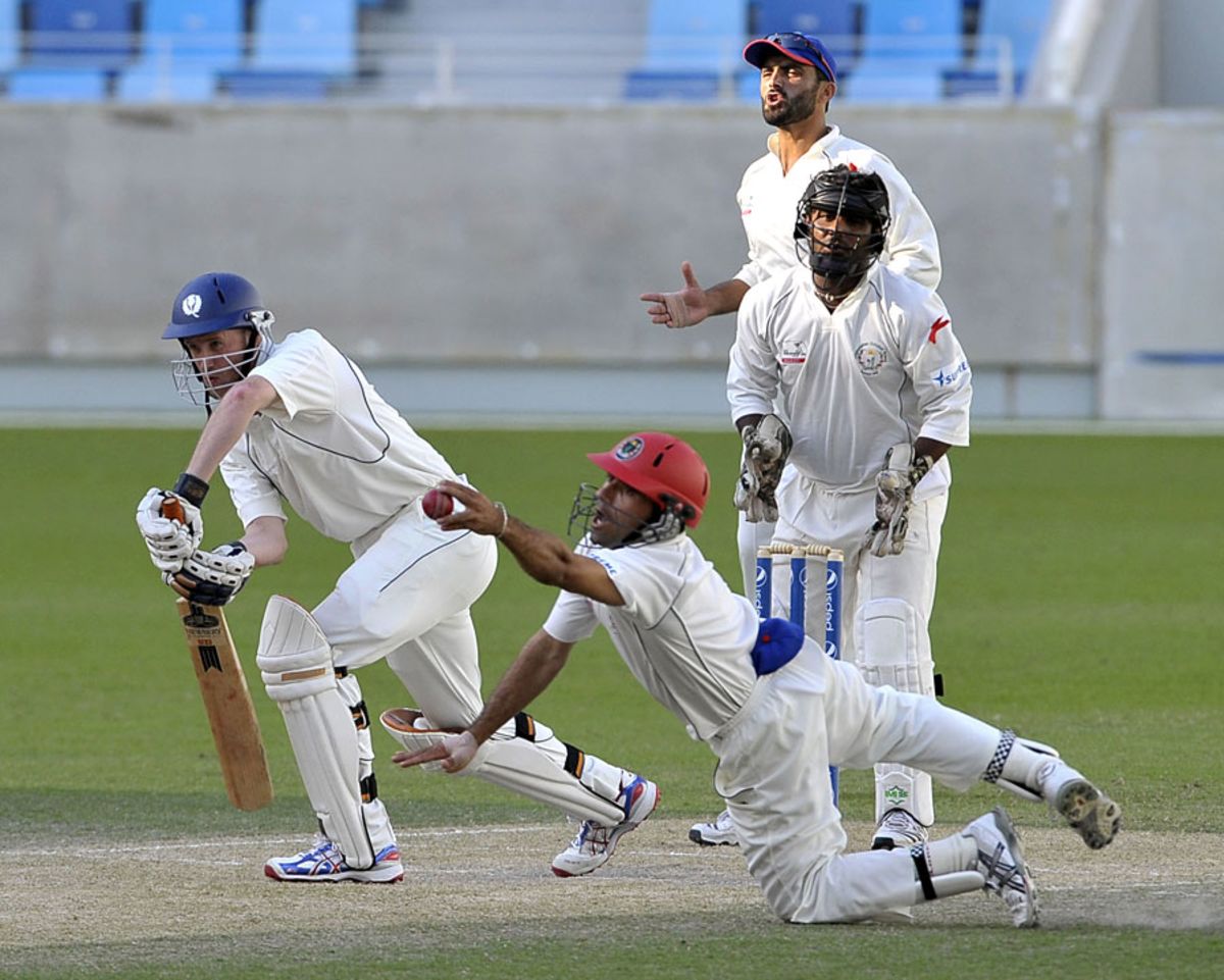 Short leg dives to reach the ball | ESPNcricinfo.com