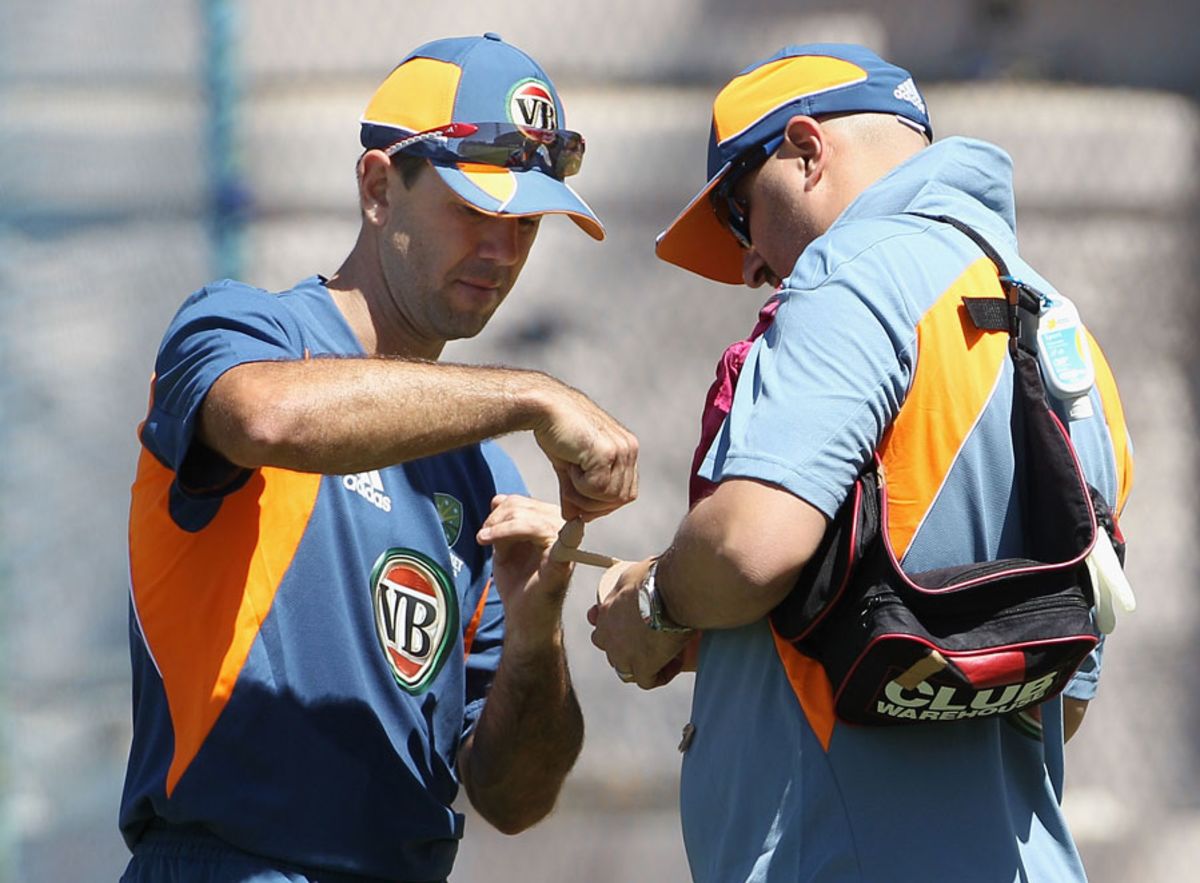 Michael Clarke takes a drinks break during practice | ESPNcricinfo.com