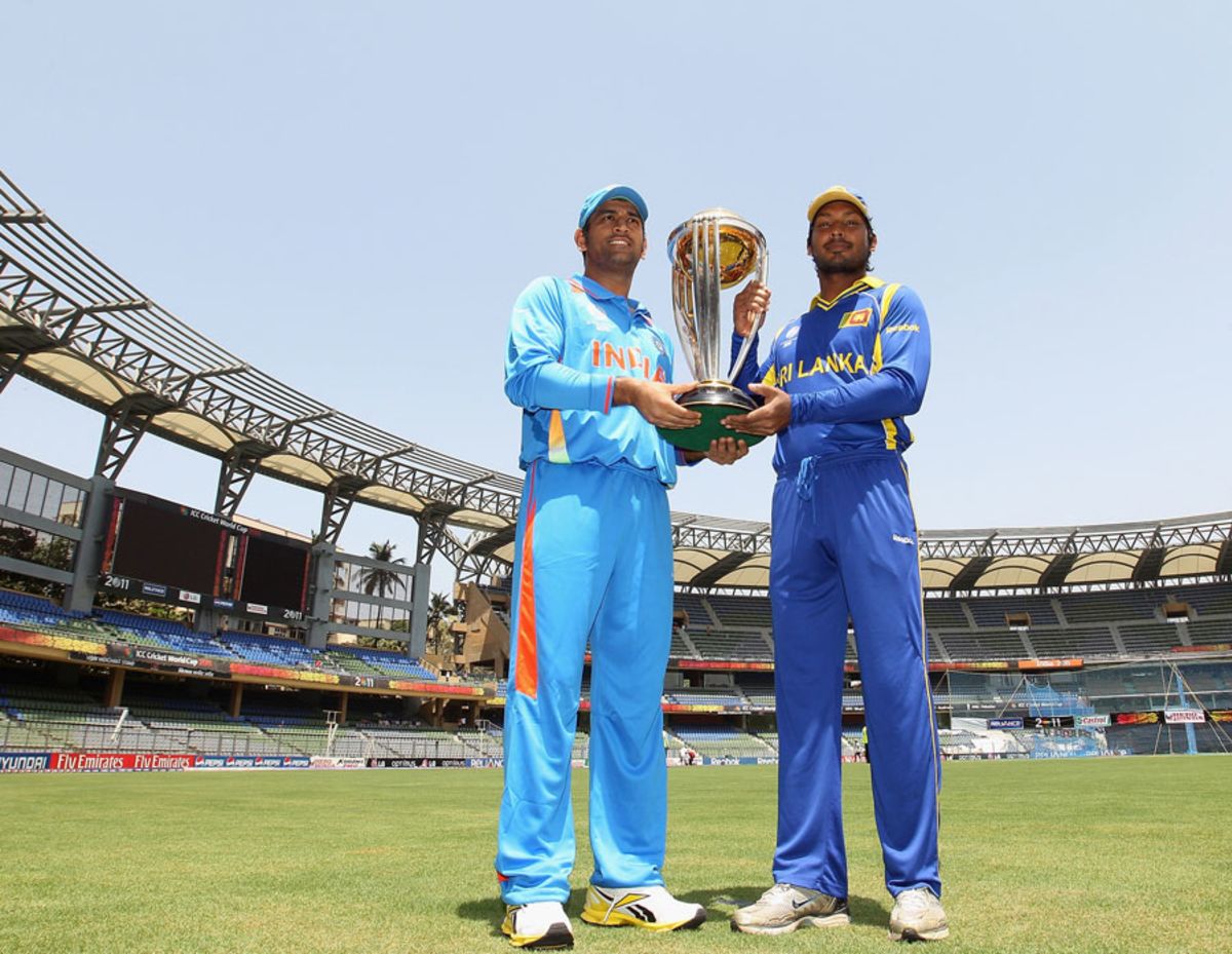 MS Dhoni and Kumar Sangakkara hold aloft the World Cup at the Wankhede ...