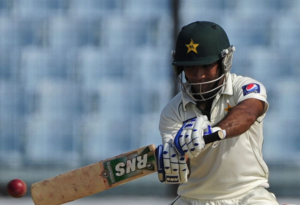 Asad Shafiq kisses his helmet on reaching his century | ESPNcricinfo.com