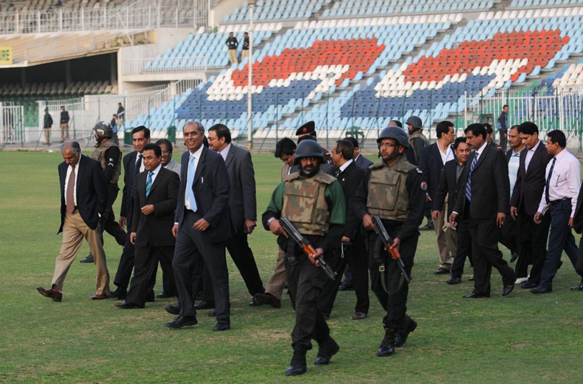 Officials of the Bangladesh and Pakistan boards are escorted onto the ...