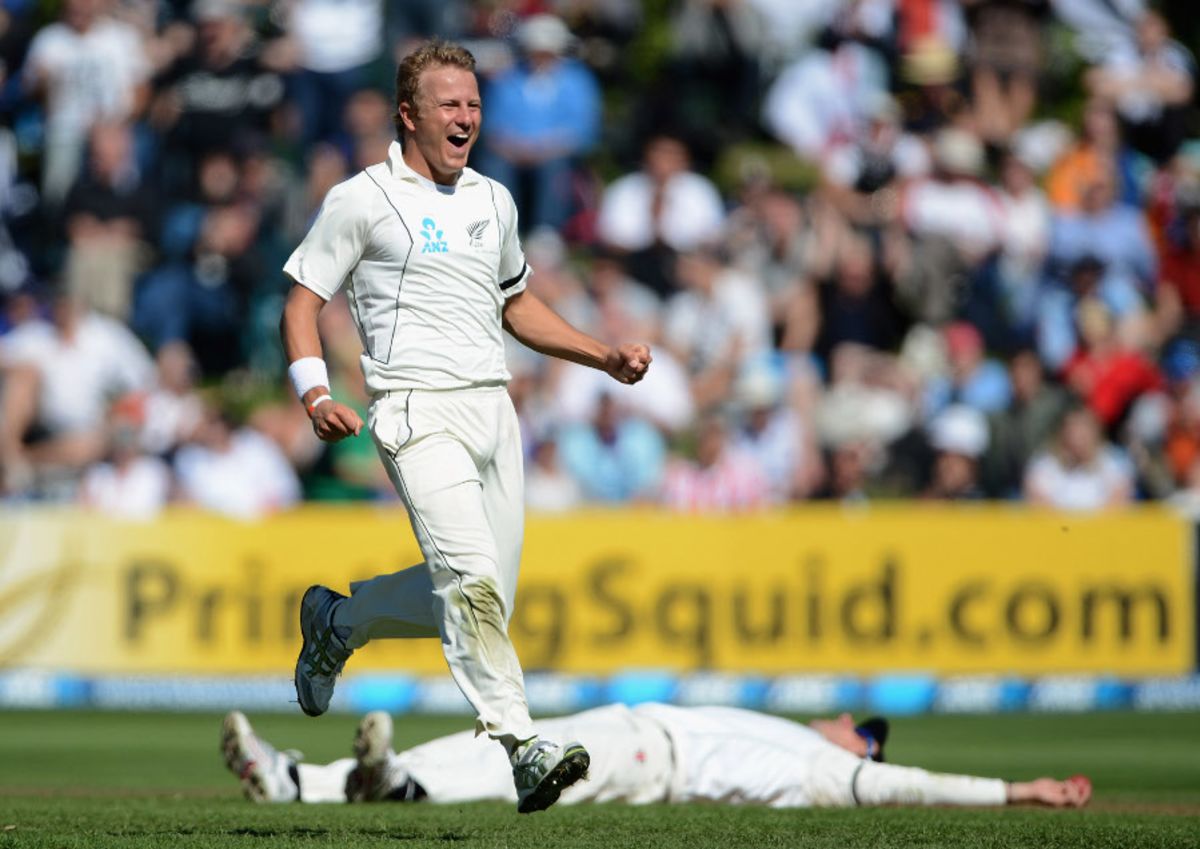 Hamish Rutherford lies on the ground behind Neil Wagner after taking a ...