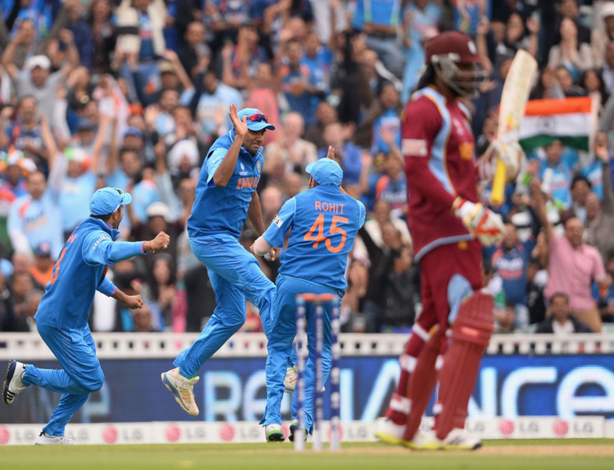 R Ashwin high-fives Rohit Sharma after completing a catch off Chris ... R Ashwin high-fives Rohit Sharma after completing a catch off Chris ...