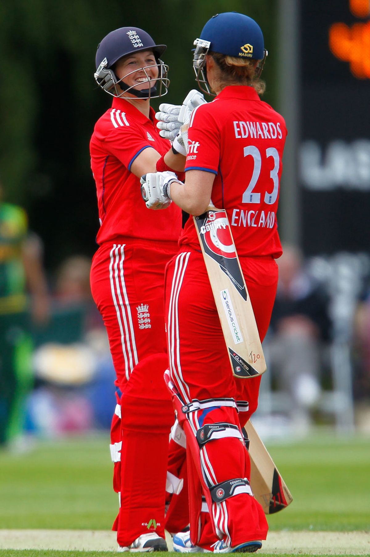 Charlotte Edwards raises her bat after reaching fifty | ESPNcricinfo.com