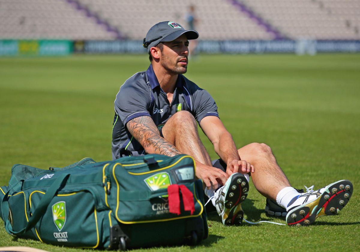 Mitchell Johnson pulls on his spikes | ESPNcricinfo.com