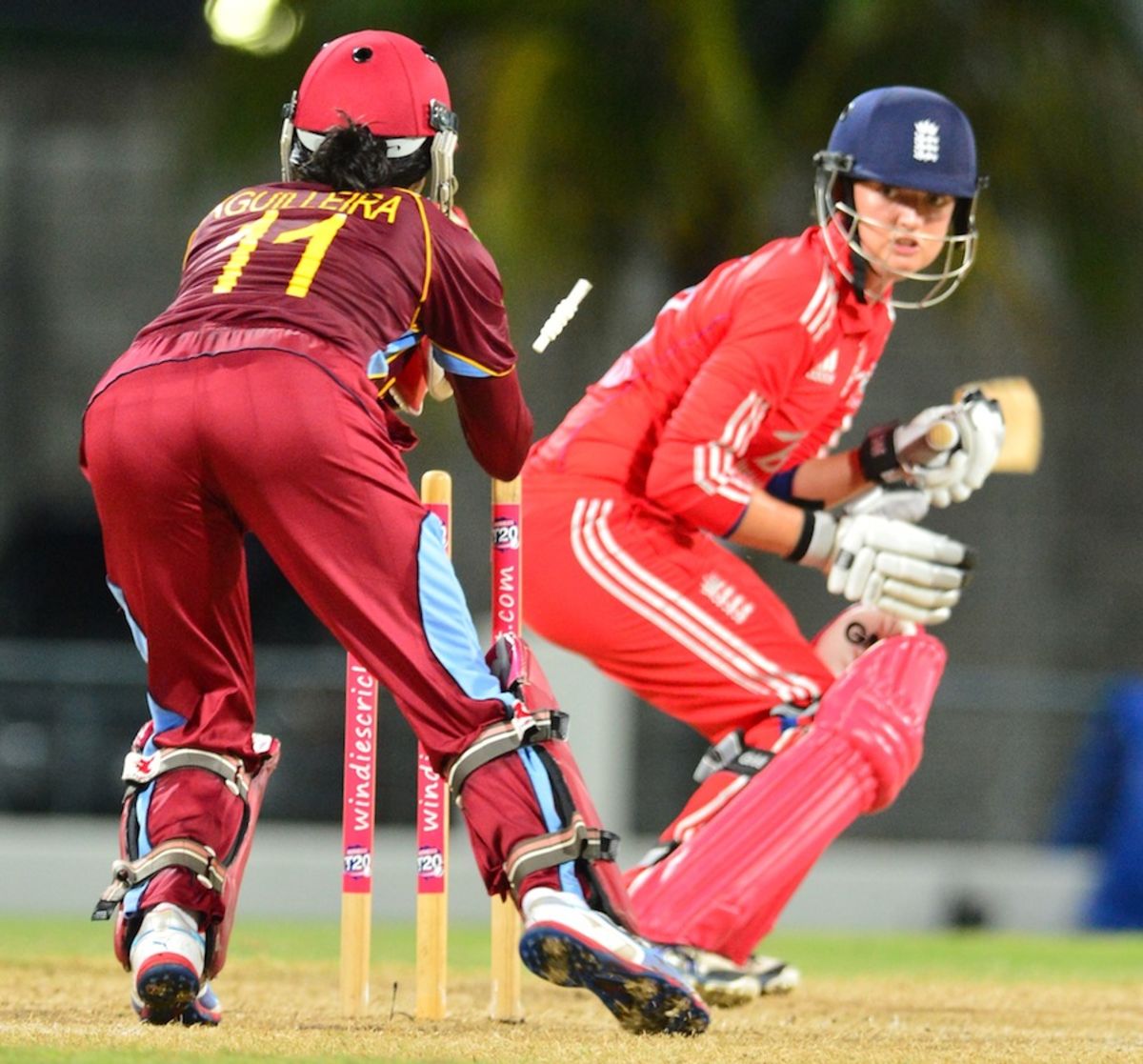 Shaquana Quintyne is mobbed by her teammates after her maiden five-for ...