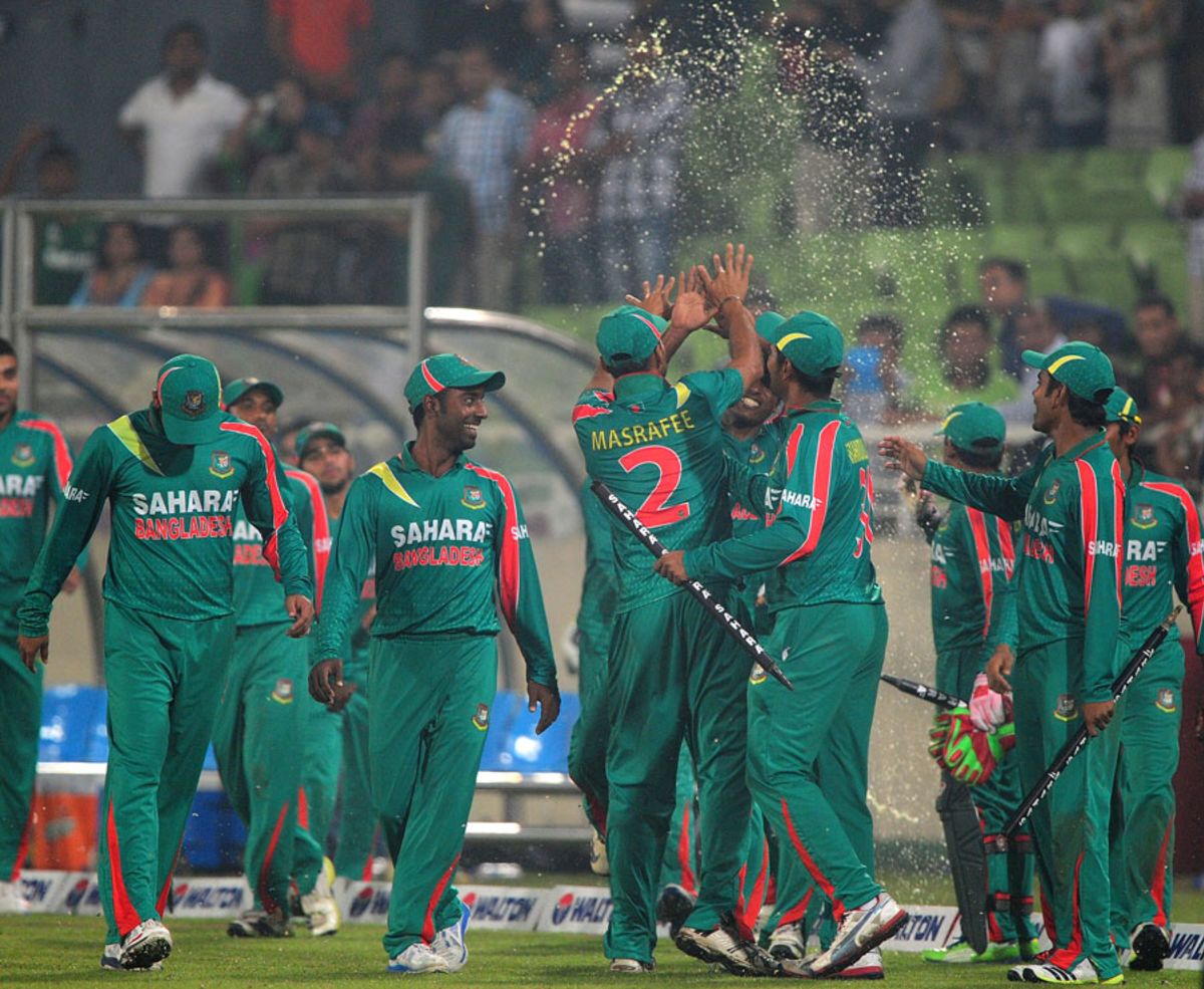 The Bangladesh players take a victory lap to celebrate their win ...