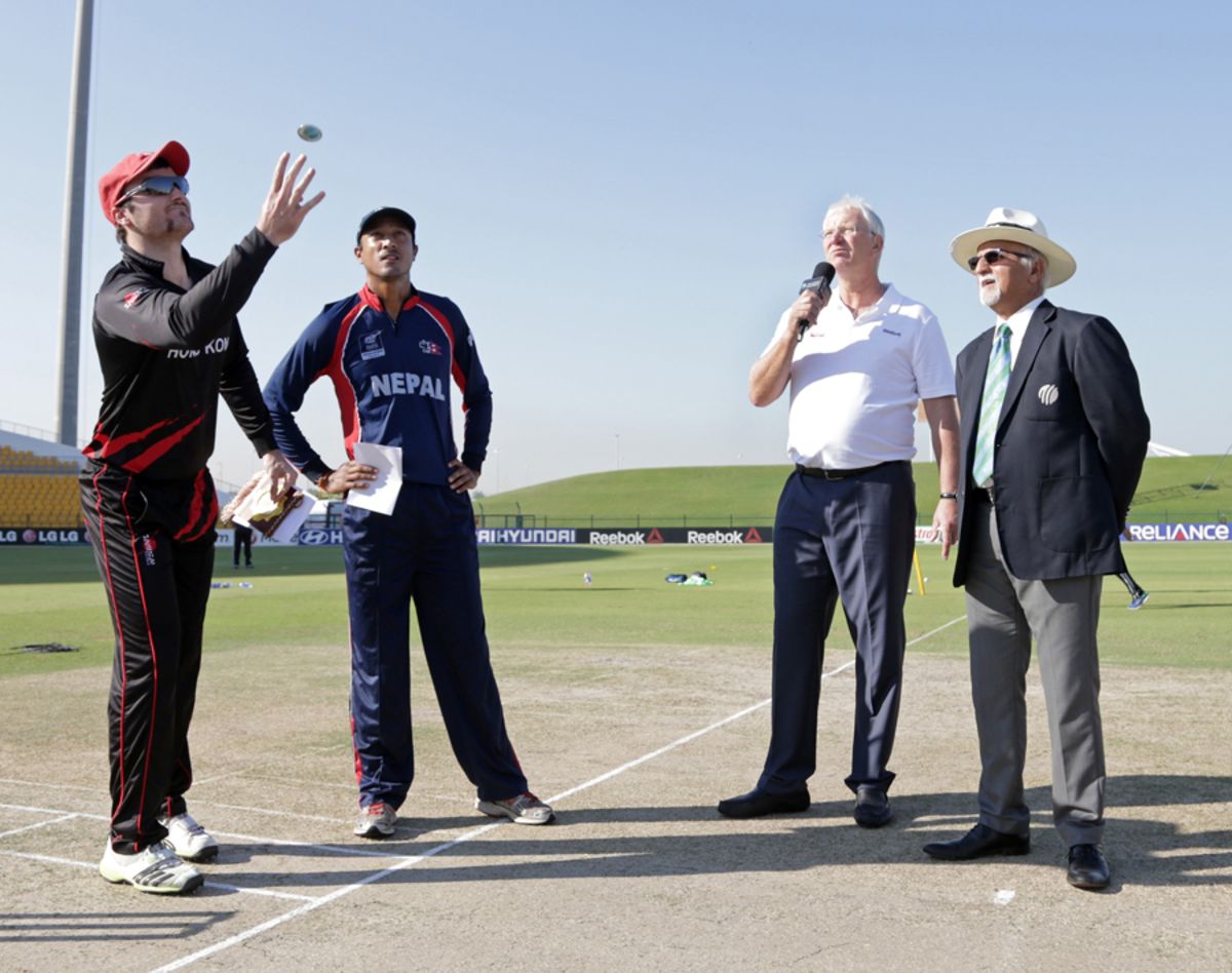Jamie Atkinson captain of Hong Kong tosses the coin with Paras Khadka ...