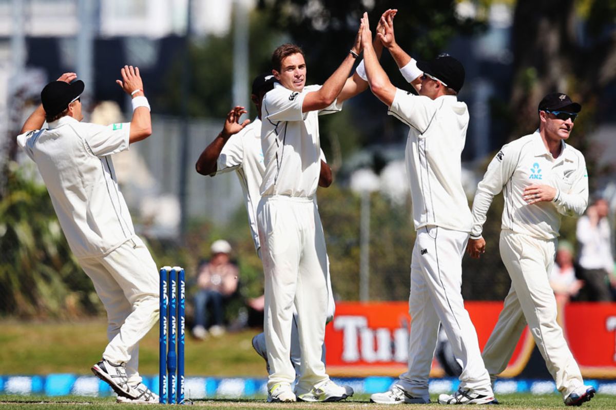 Tim Southee high-fives with Trent Boult | ESPNcricinfo.com