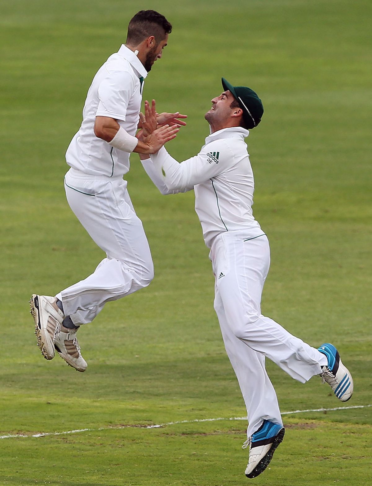 Wayne Parnell and Dean Elgar celebrate the wicket of Shaun Marsh ...