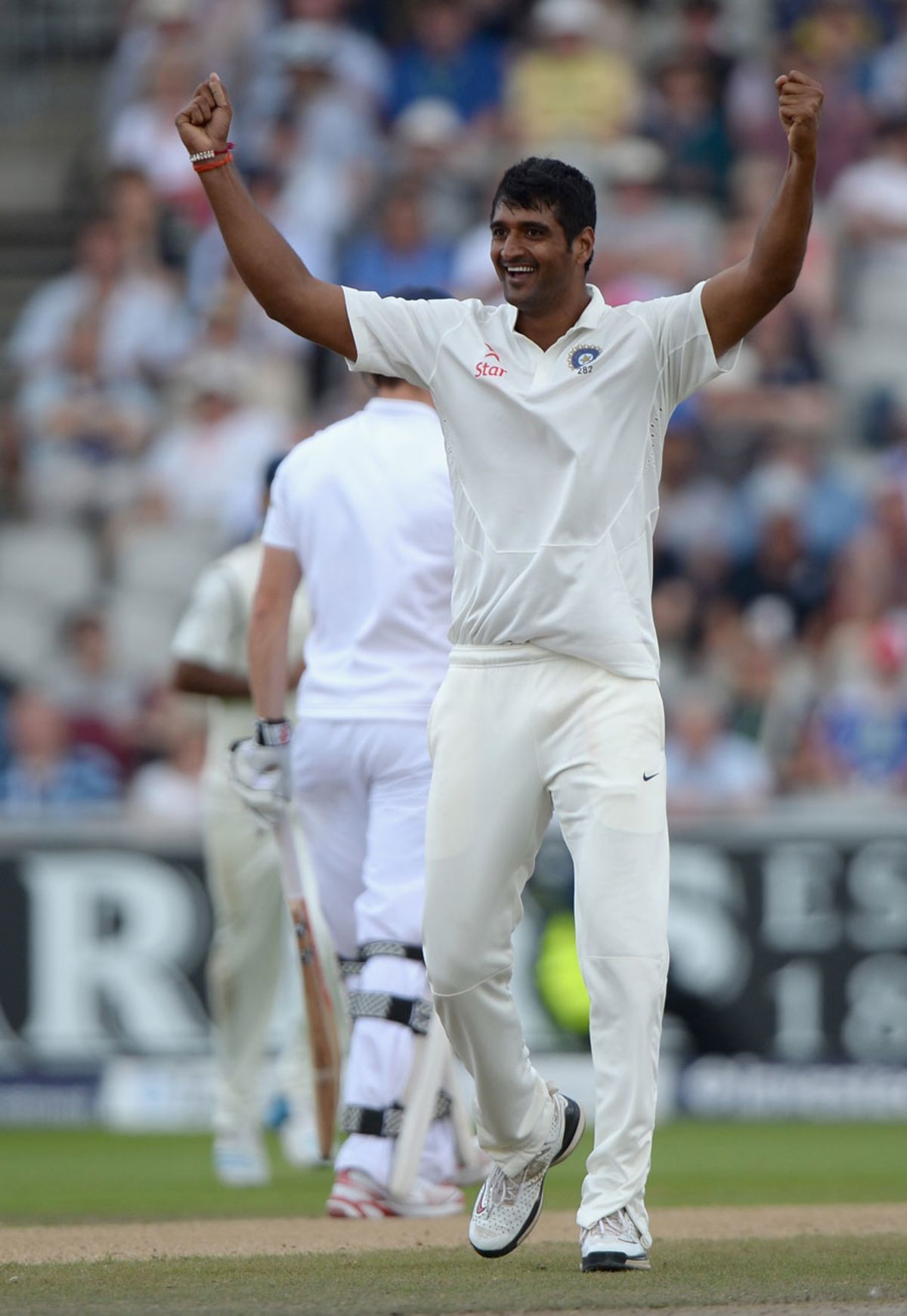 Pankaj Singh is congratulated after his first Test wicket ...