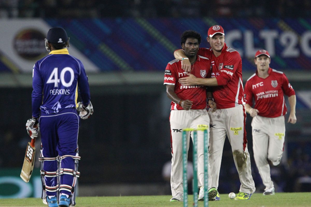 Parvinder Awana gets a hug after dismissing William Perkins ...