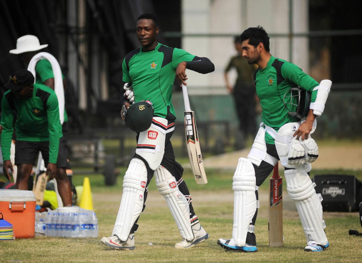 Stephen Mangongo and Brendan Taylor interact with the press ...