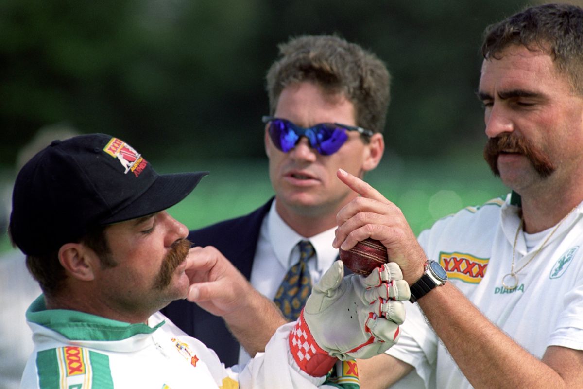 Ian Botham shakes hands with Allan Border during his final match ...