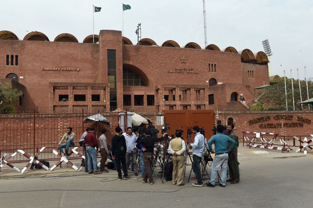 Media personnel wait outside the Gaddafi Stadium | ESPNcricinfo.com