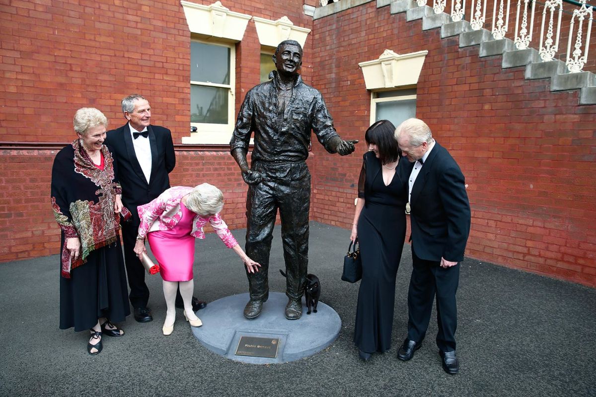 Members of the Benaud family stand next to a statue of Richie Benaud ...