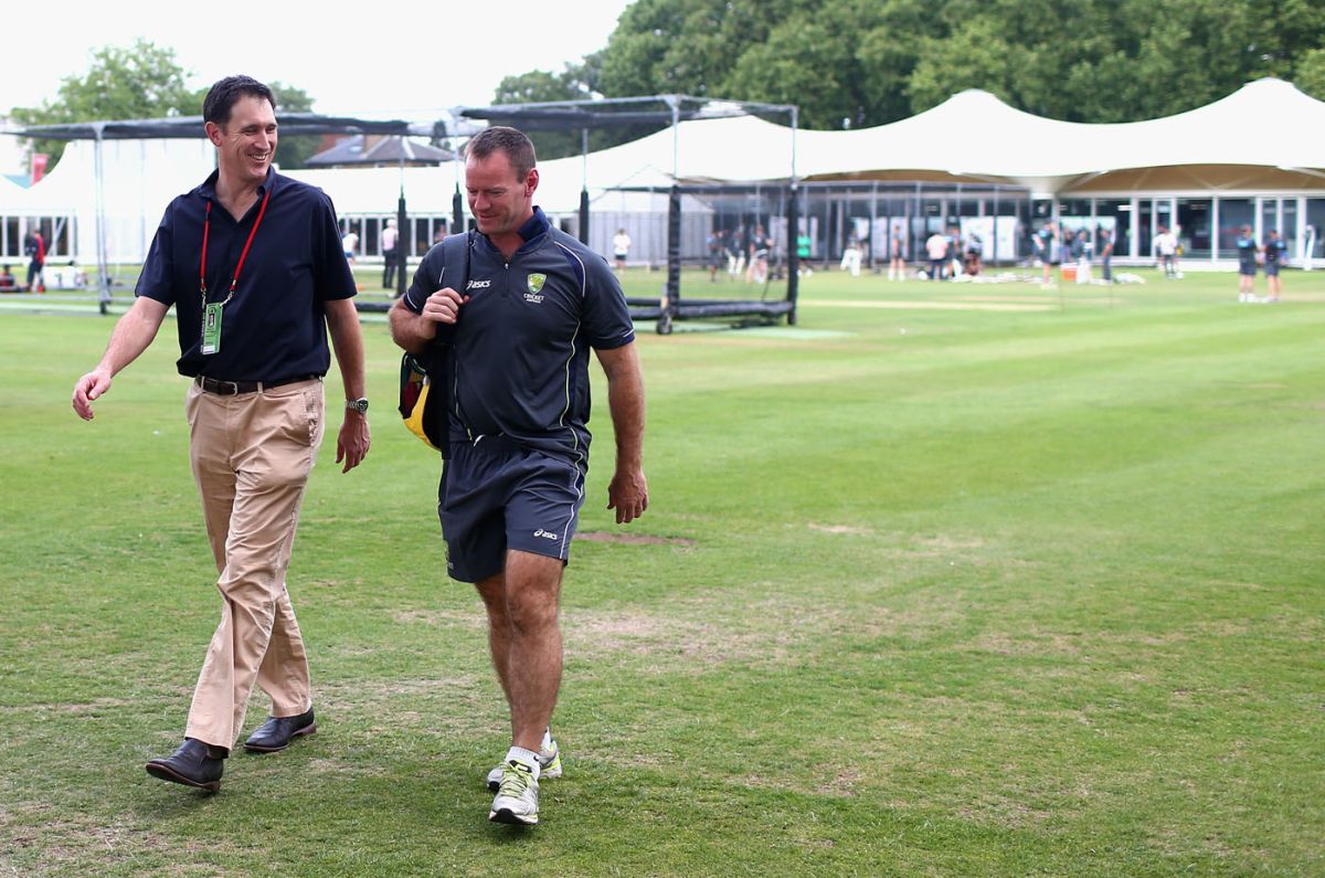 James Sutherland has a word with Pat Howard at an Australia net session ...
