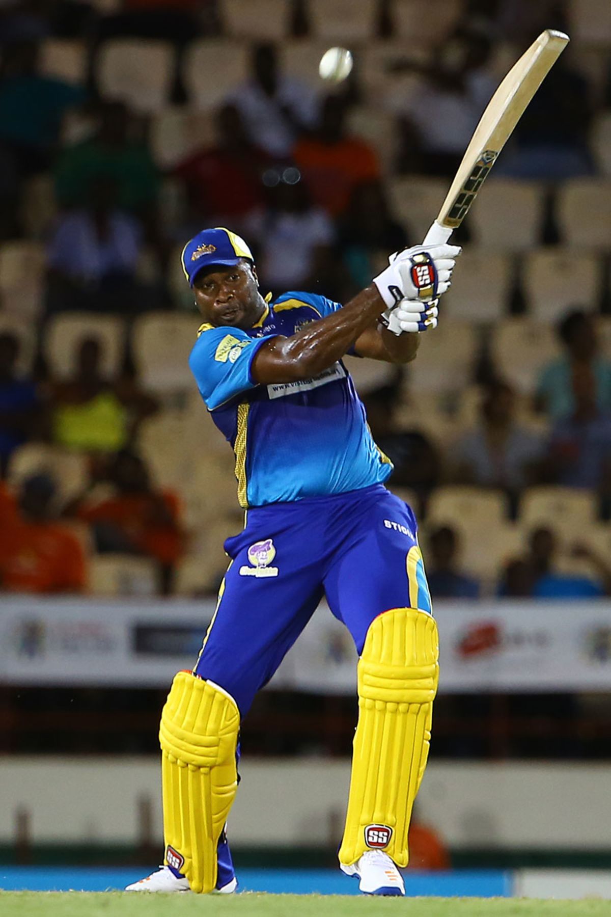 Kieron Pollard hits a six over long-off off the back foot ...