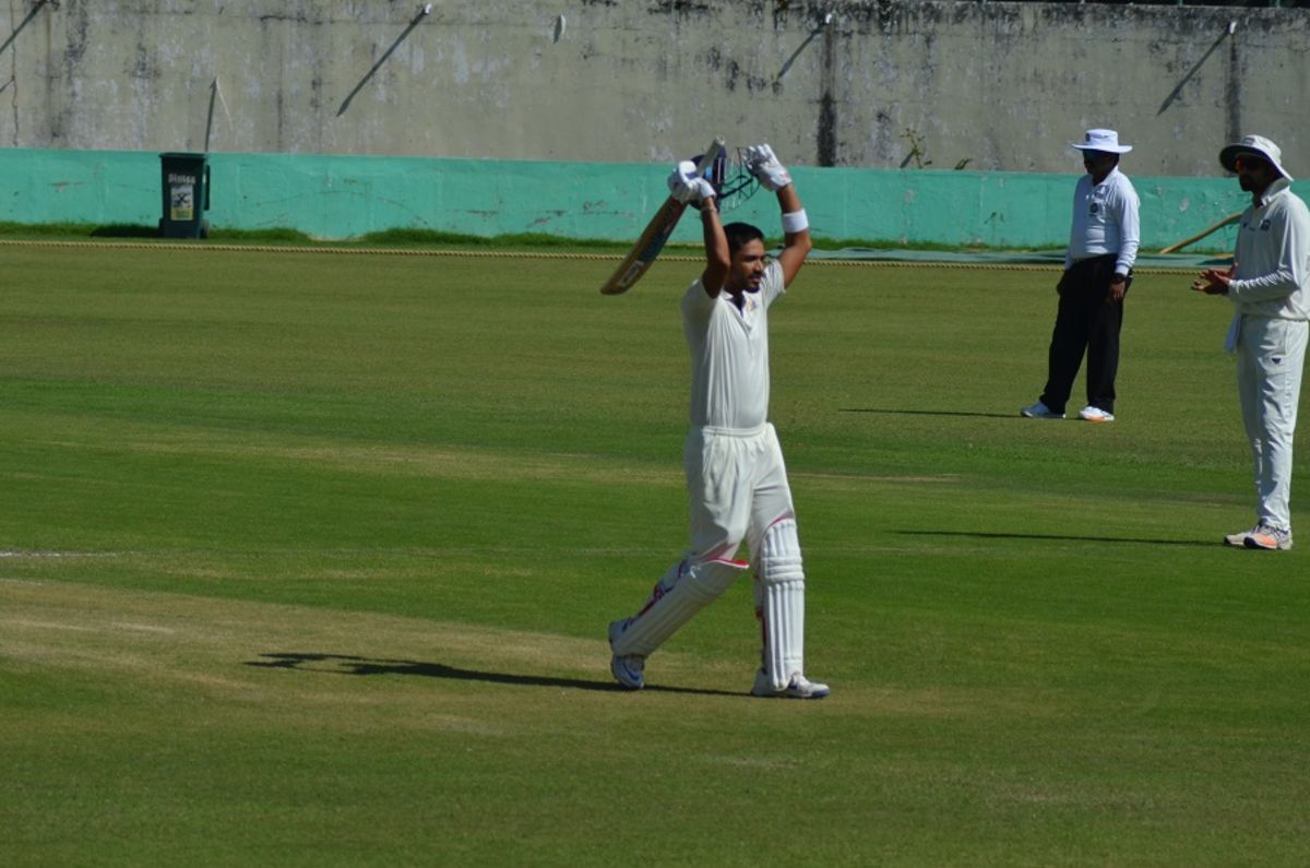Prashant Chopra raises his bat after reaching 300 | ESPNcricinfo.com