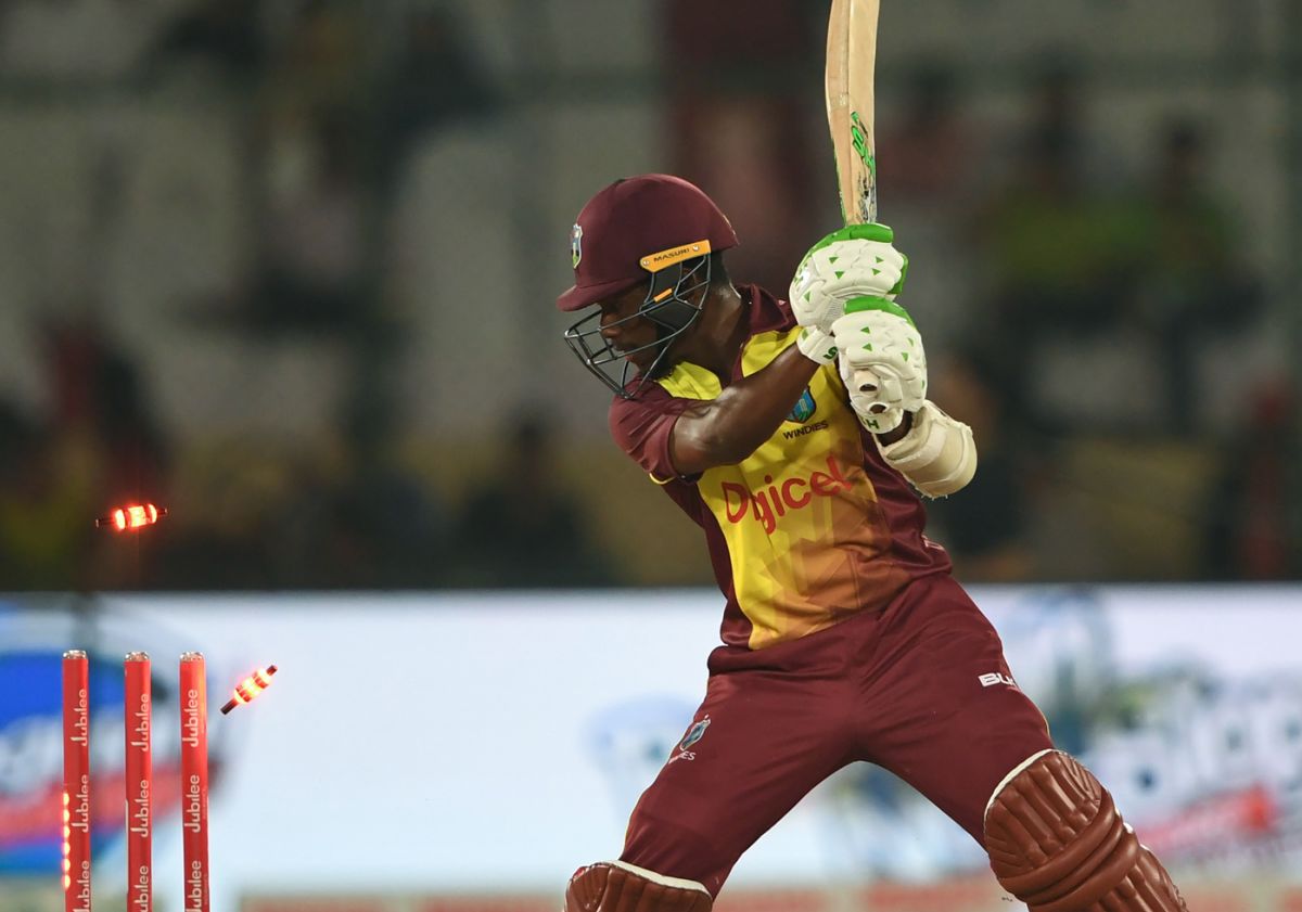 Jason Mohammed and Sarfraz Ahmed pose with the T20I series trophy ...